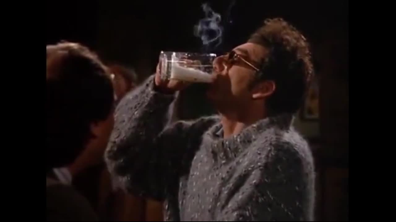 Kramer drinks beer and smokes cigarette video clip by Seinfeld