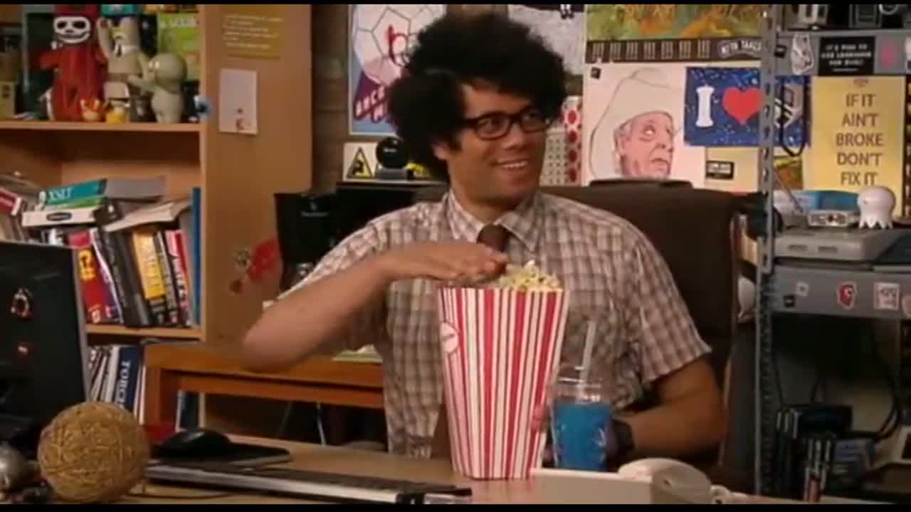 Listening to story with popcorn video clip by IT Crowd
